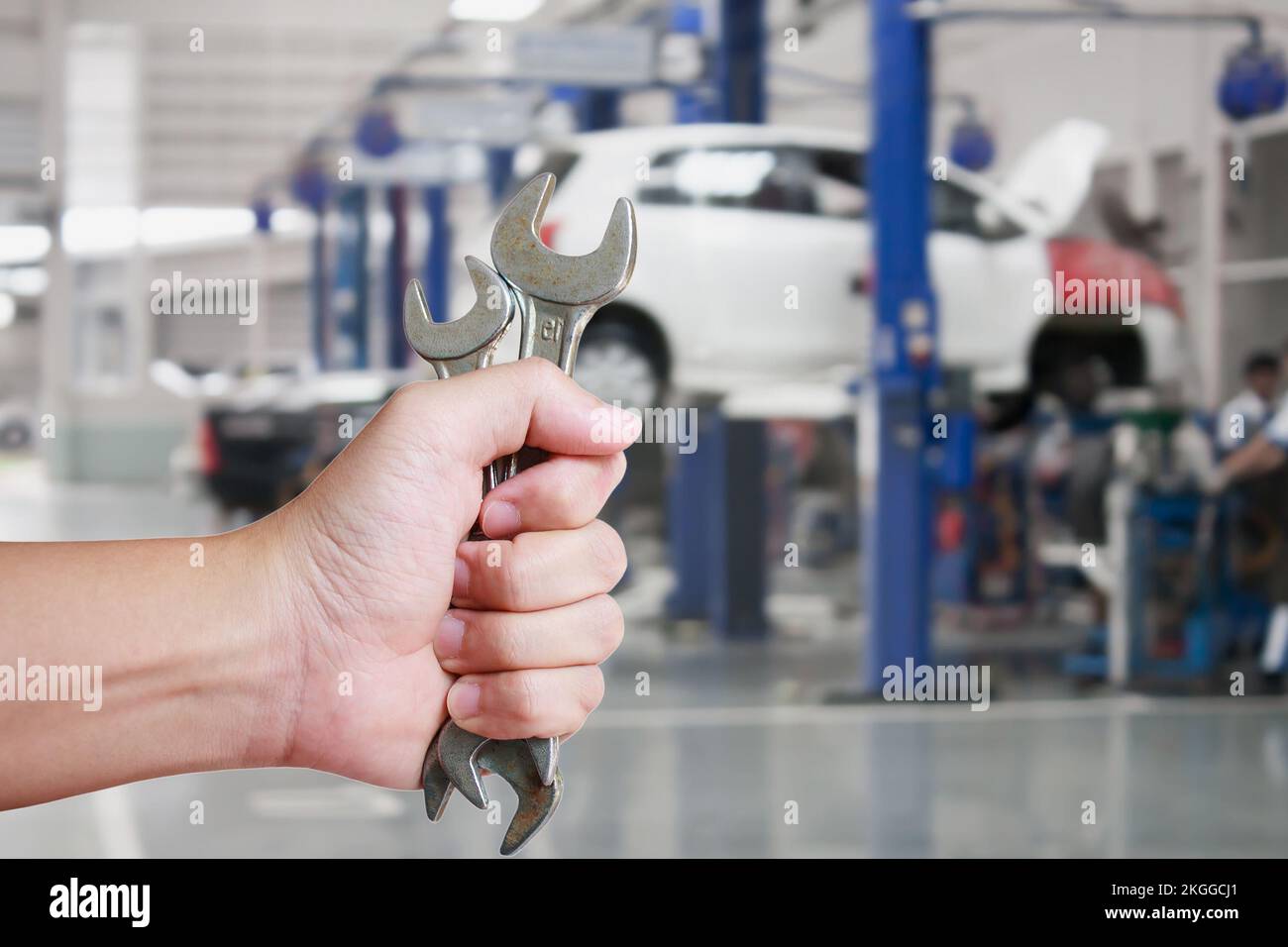Hand of professional Auto mechanic with wrench, Auto repair service ...