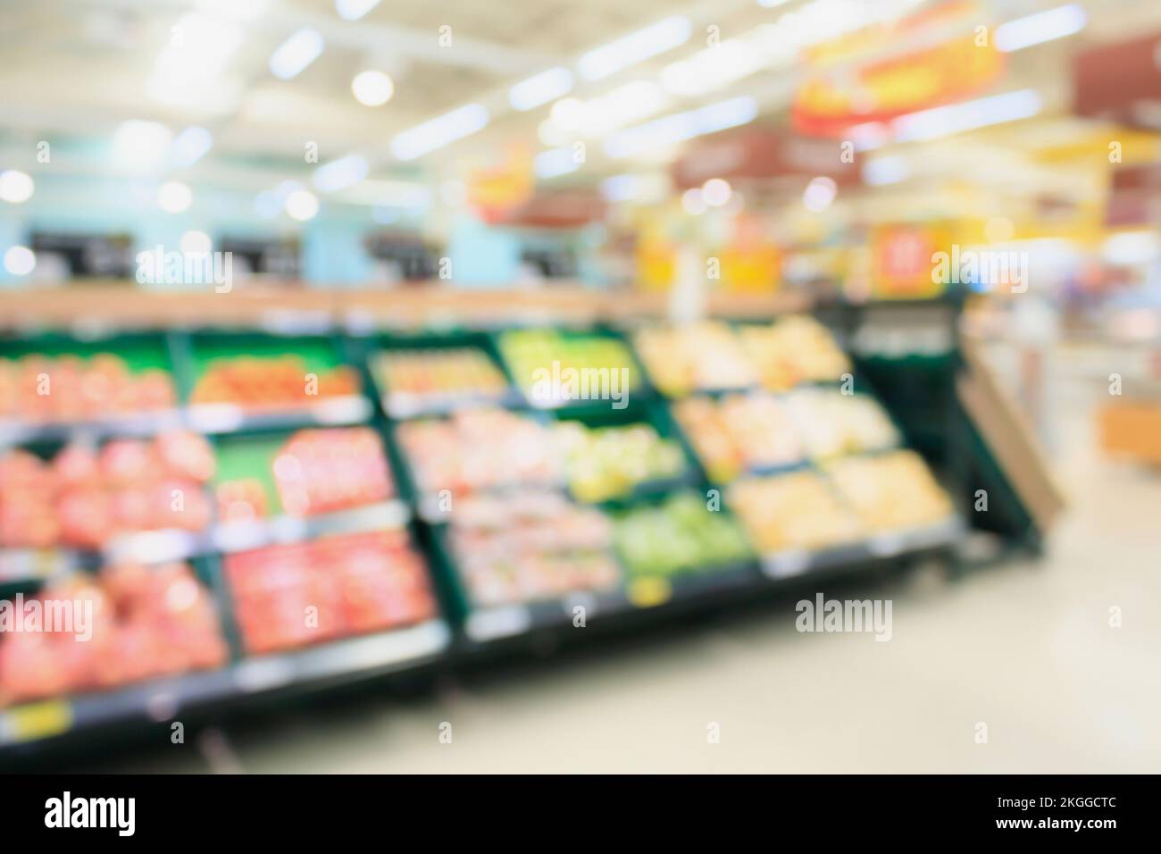 Fruits and vegetables on shelves in supermarket blur background Stock ...