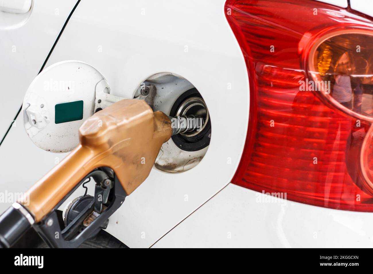 To fill the machine with fuel. Car fill with gasoline at a gas station ...