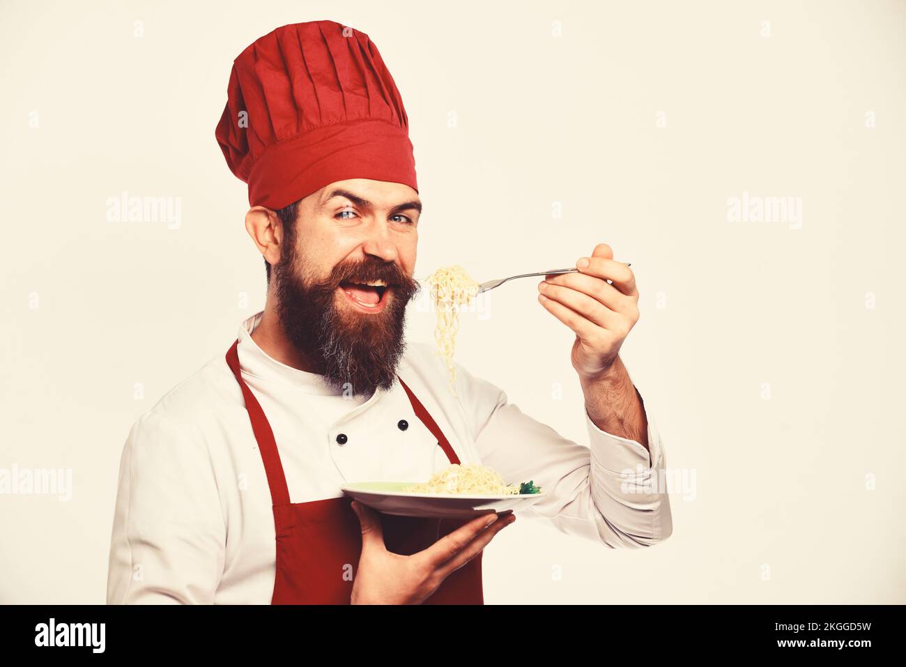 Chef eats italian or asian noodles. Cook with happy face Stock Photo ...
