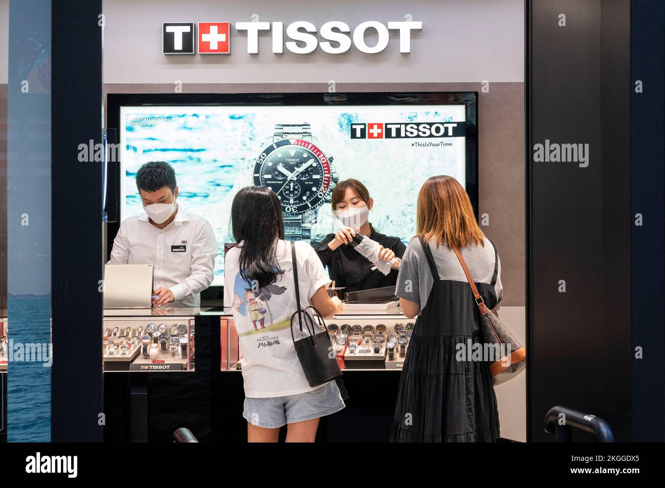 Shoppers are seen at the Swiss watchmaker Tissot store in Hong Kong ...