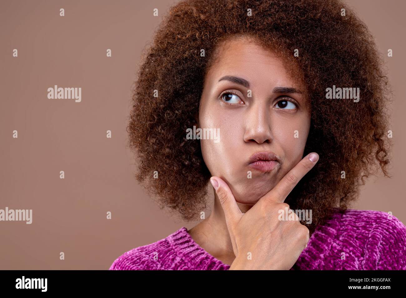 Pretty young confused woman hi-res stock photography and images - Alamy