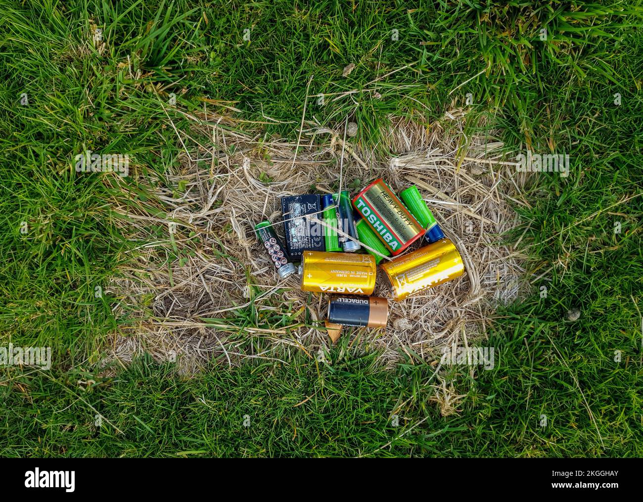 Image that signifies pollution with batteries and accumulators thrown ...