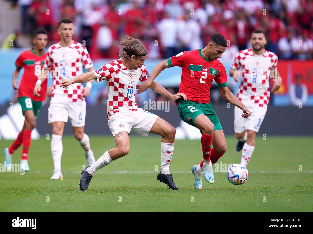 Morocco's Achraf Hakimi (right) and Croatia’s Borna Sosa battle for the ball during the FIFA ...