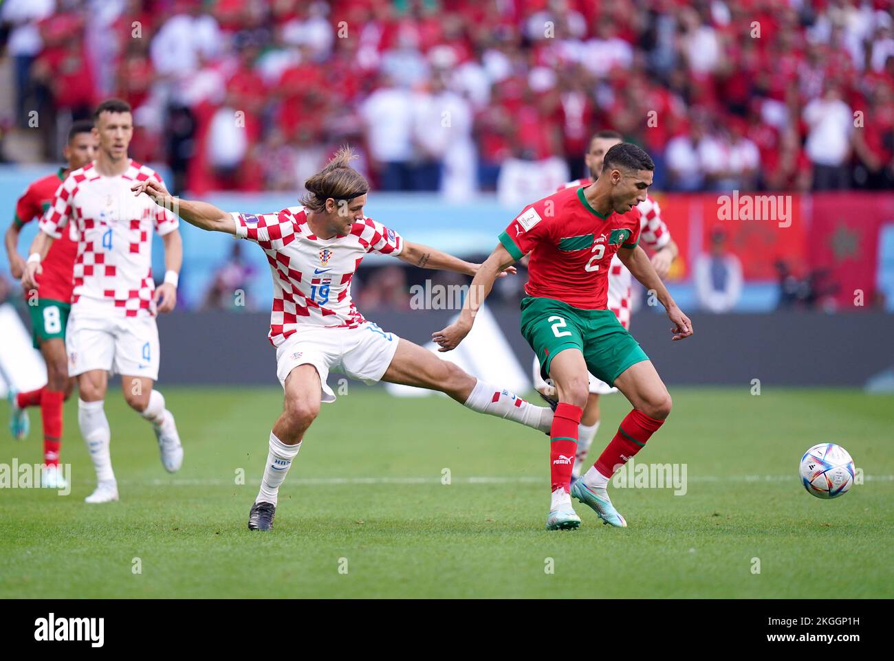 Morocco's Achraf Hakimi (right) and Croatia’s Borna Sosa battle for the ball during the FIFA ...