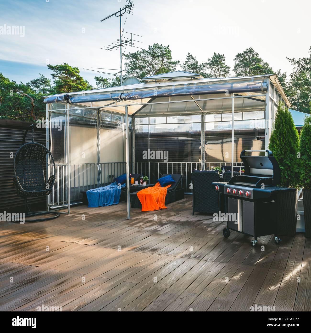Wooden outdoor terrace of private house with canopy. Modern grill Stock ...