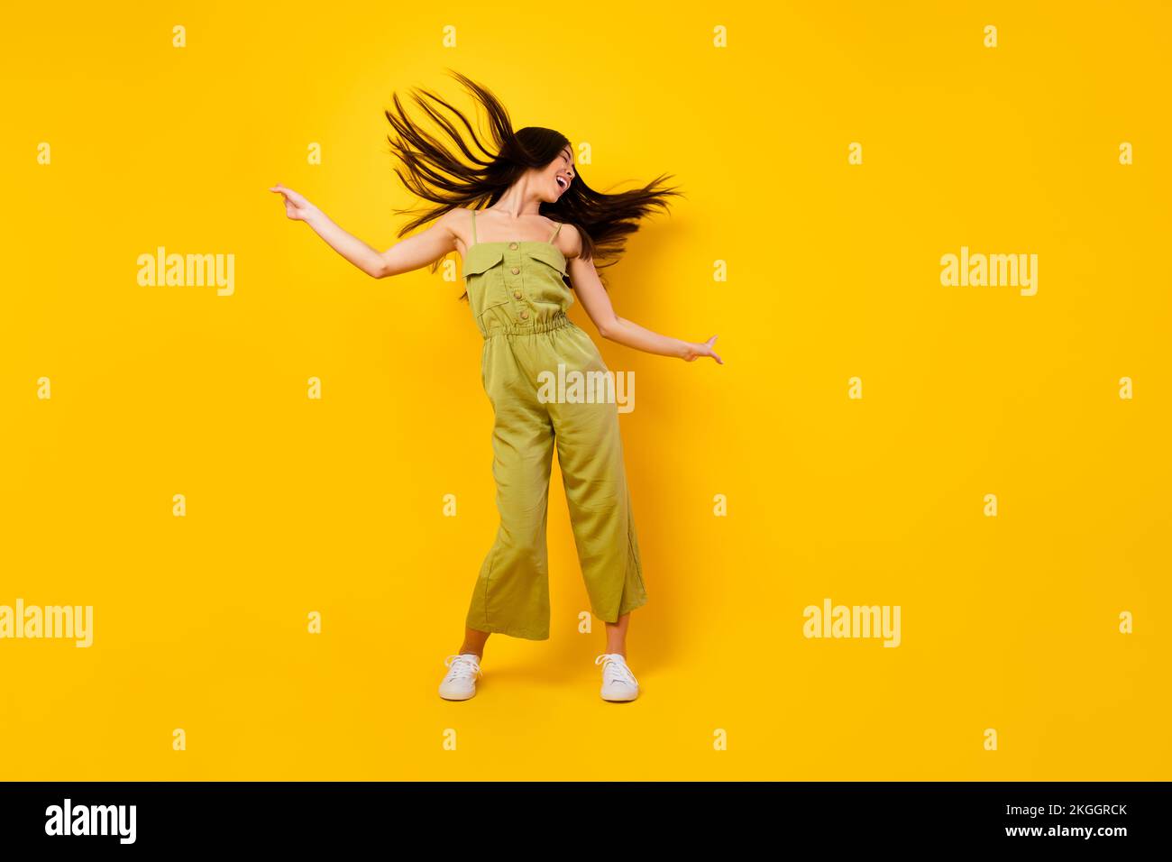 Full body photo of pretty positive girl flying hair enjoy dancing ...