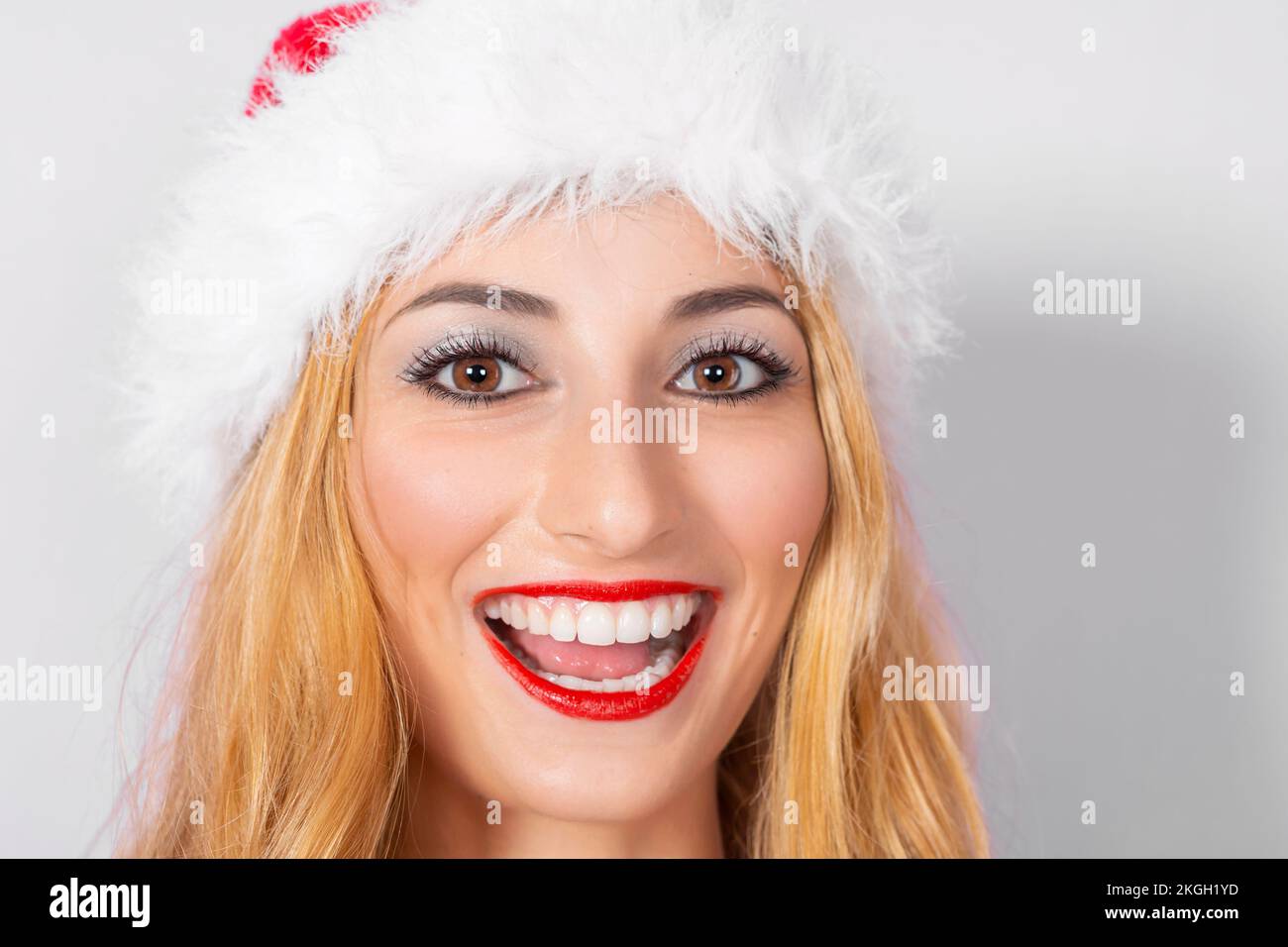 woman's face with christmas cap and cute expression Stock Photo - Alamy