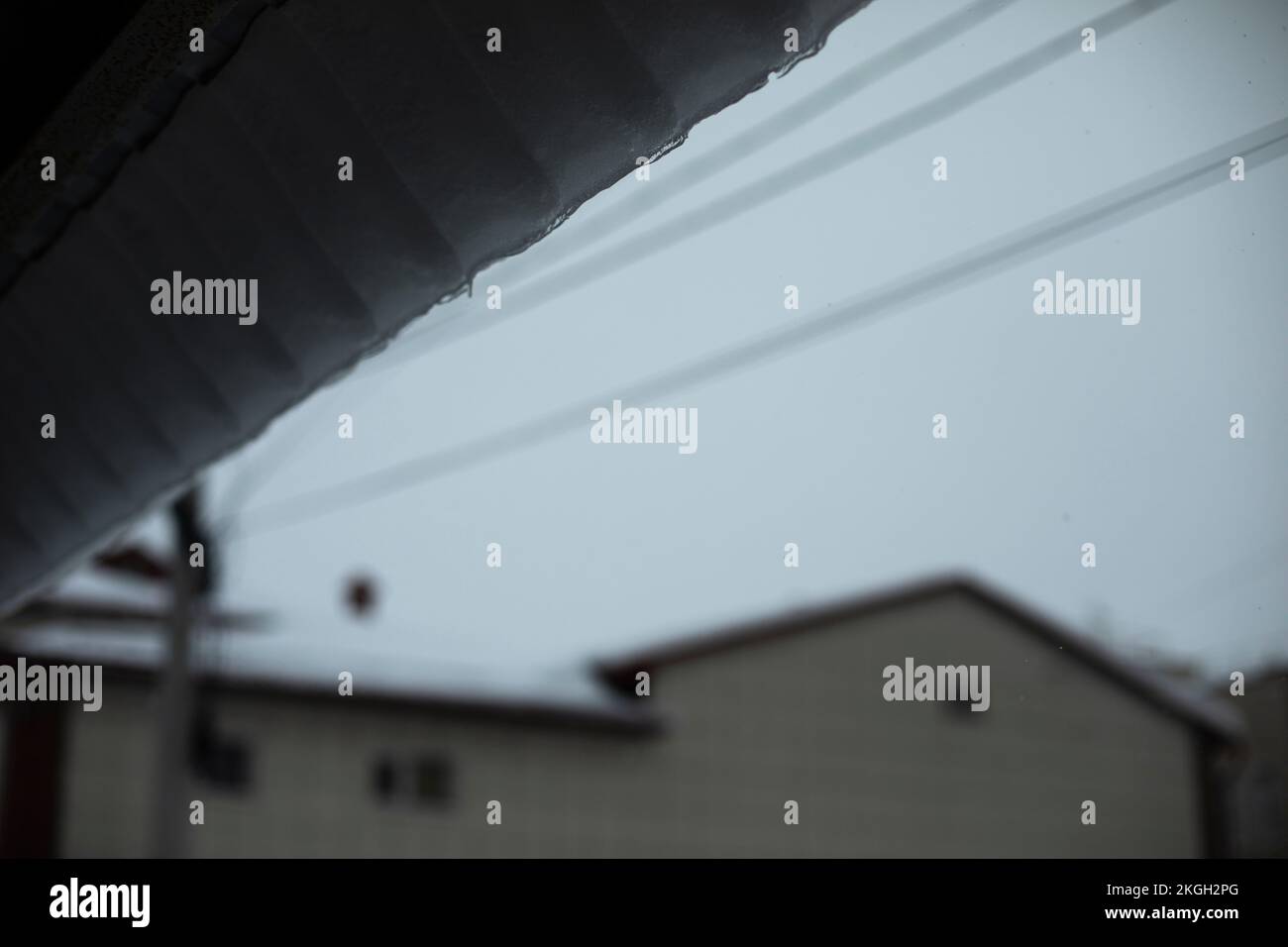 Ice snow drip from roof hi-res stock photography and images - Alamy