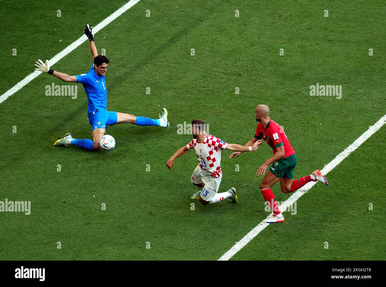 Morocco goalkeeper Yassine Bounou saves from Croatia's Nikola Vlasic ...