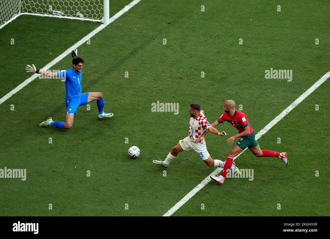Morocco goalkeeper Yassine Bounou saves from Croatia's Nikola Vlasic ...