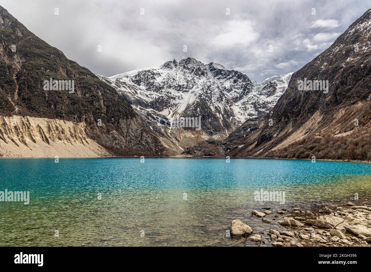 The blue Haba lake with the background of snowy rocky mountains in ...