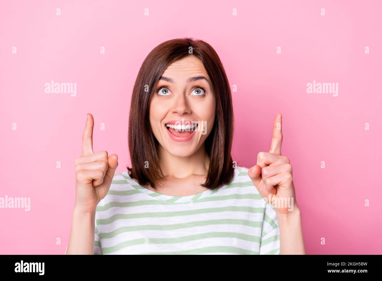 Portrait of positive cheerful girl with bob hairdo wear striped t-shirt ...