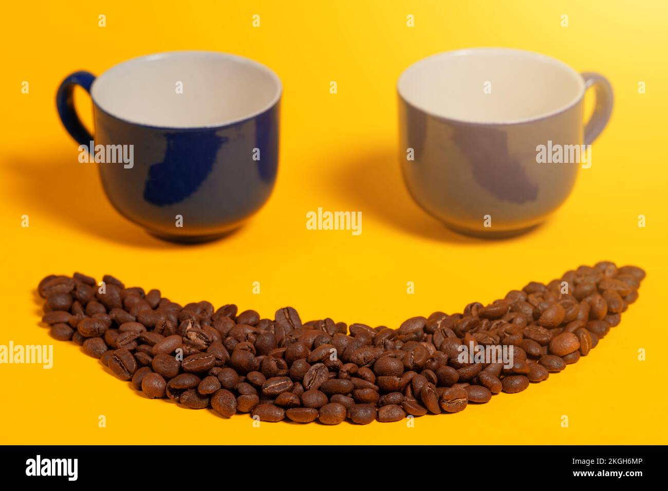 Happy emoticon made of coffee beans on a yellow background, Smiley made ...