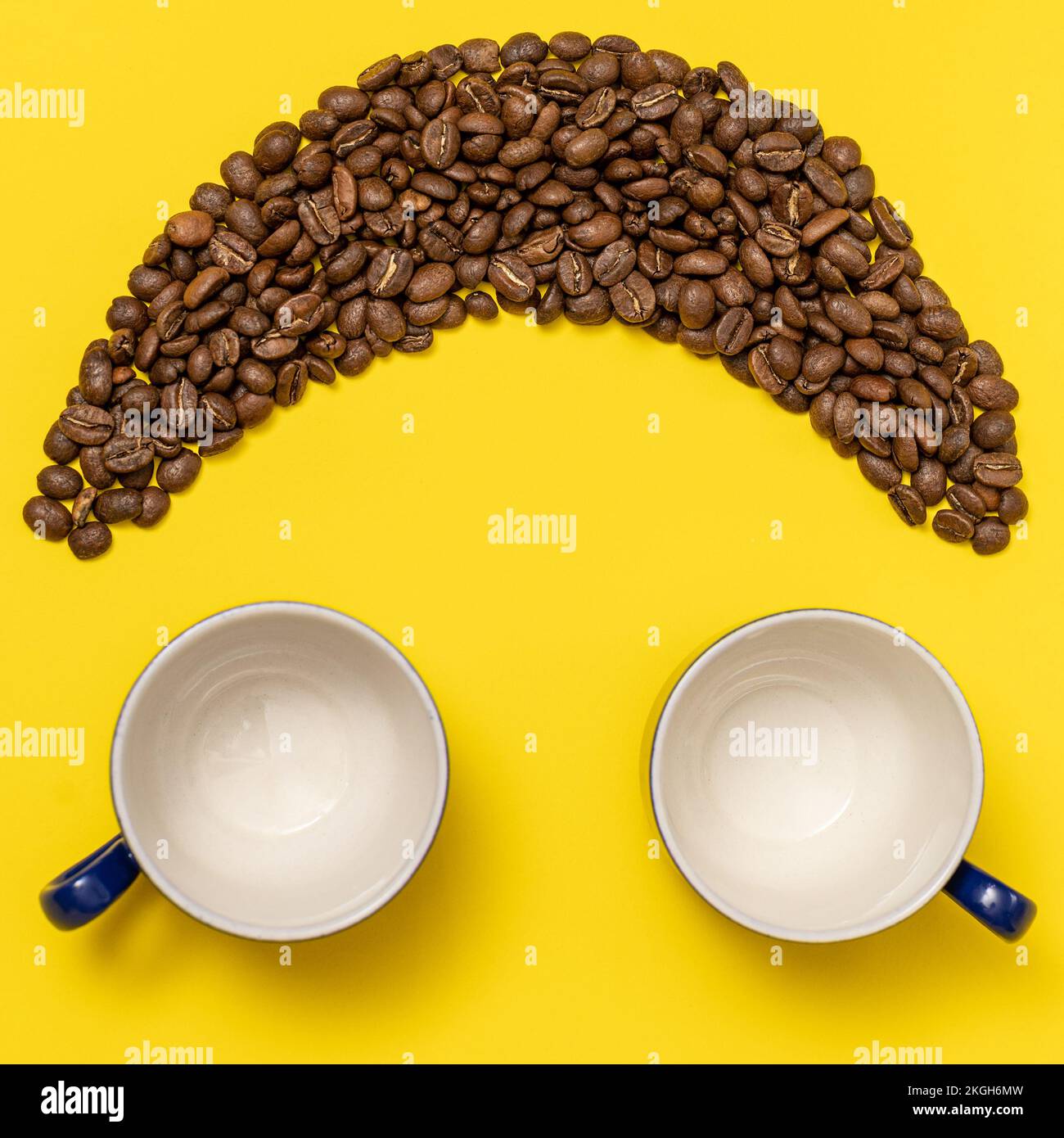 Happy emoticon made of coffee beans on a yellow background, Smiley made ...