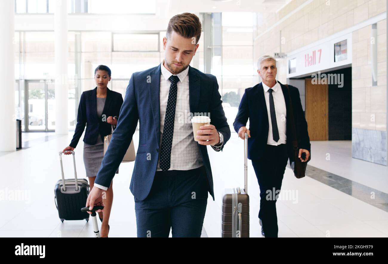 Travel, international meeting and business people walking in hotel ...