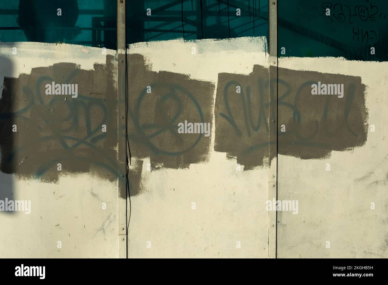 Gray paint on wall. Painted over graffiti. Fight against vandalism ...
