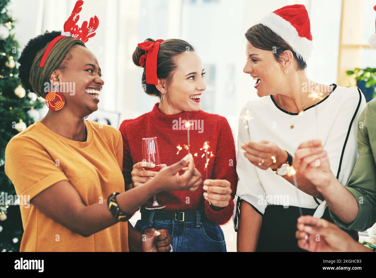 Christmas, party and sparklers with business people in office for ...