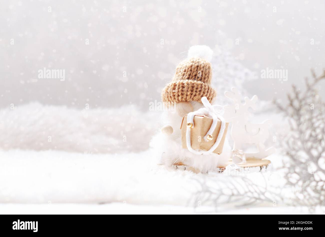 Funny gnome with Christmas decorations on a winter snowcovered ...