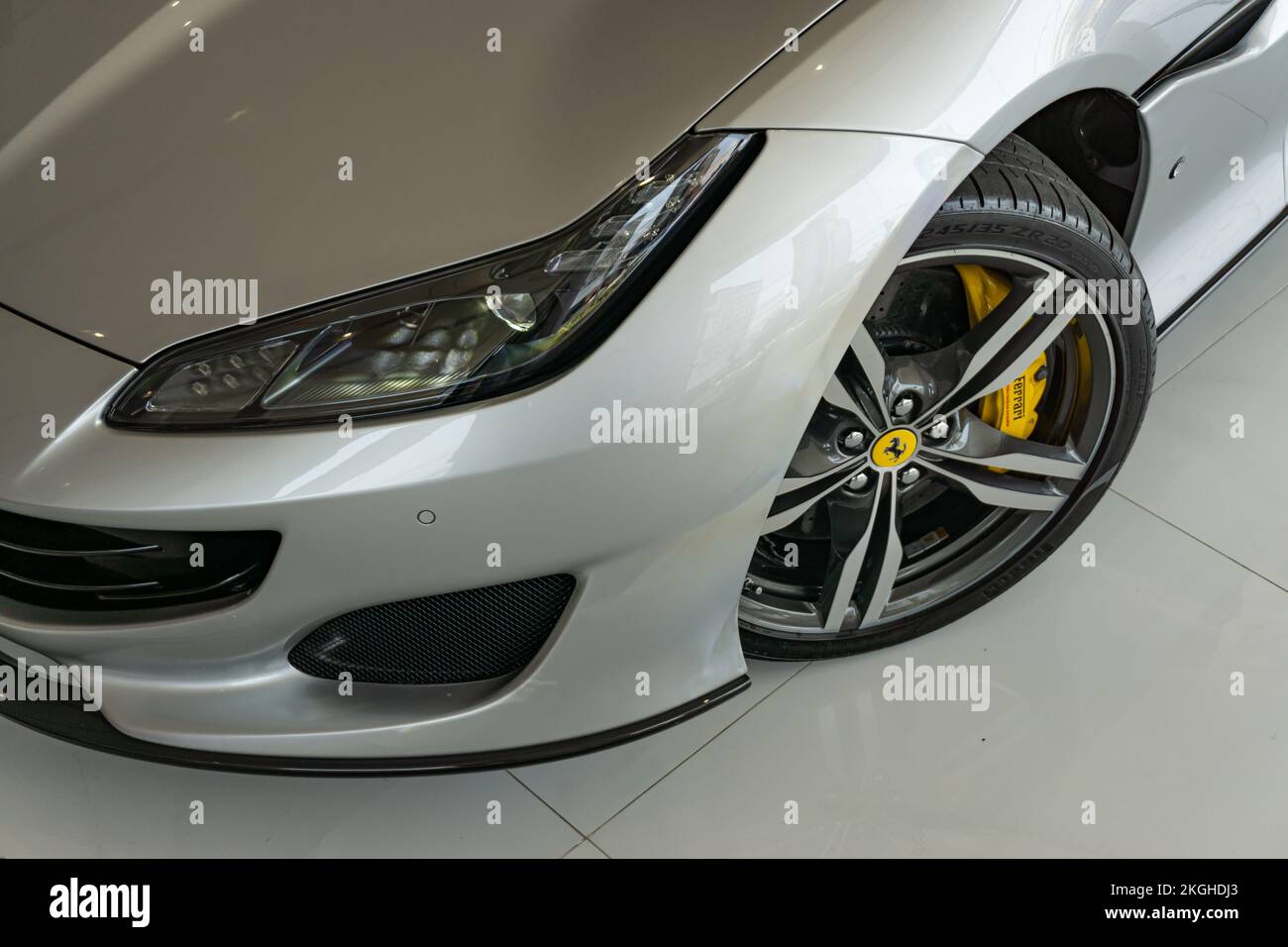 The exterior of a Ferrari Portofino gray car with yellow detailing on ...