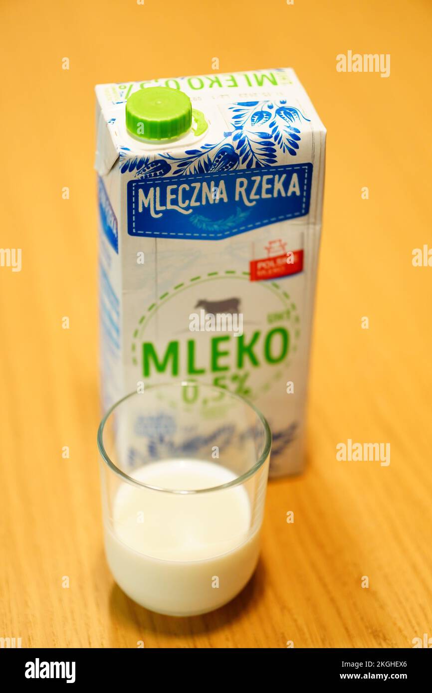A vertical closeup shot of a package of Polish Mleczna Rzeka brand milk ...