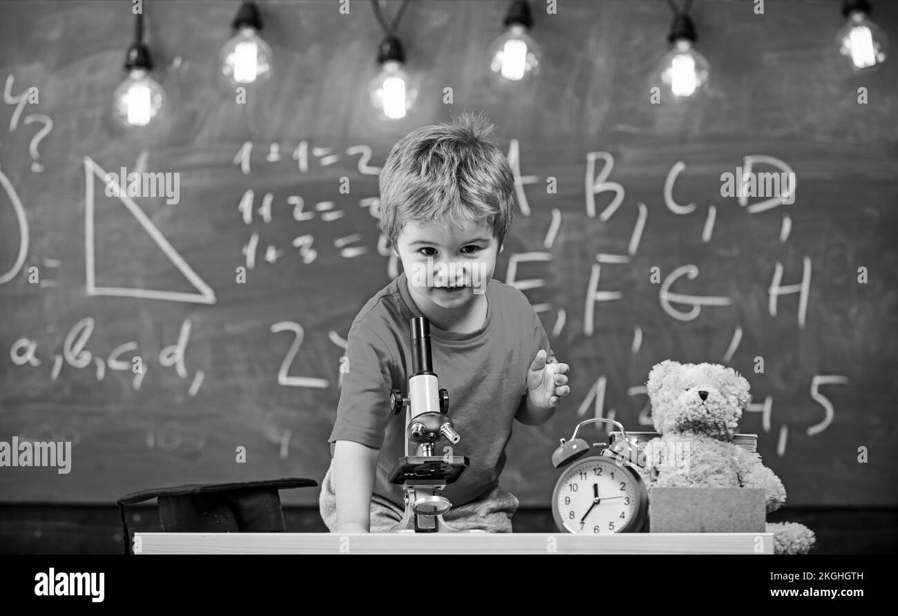 First former interested in studying, learning, education. Kid boy near ...