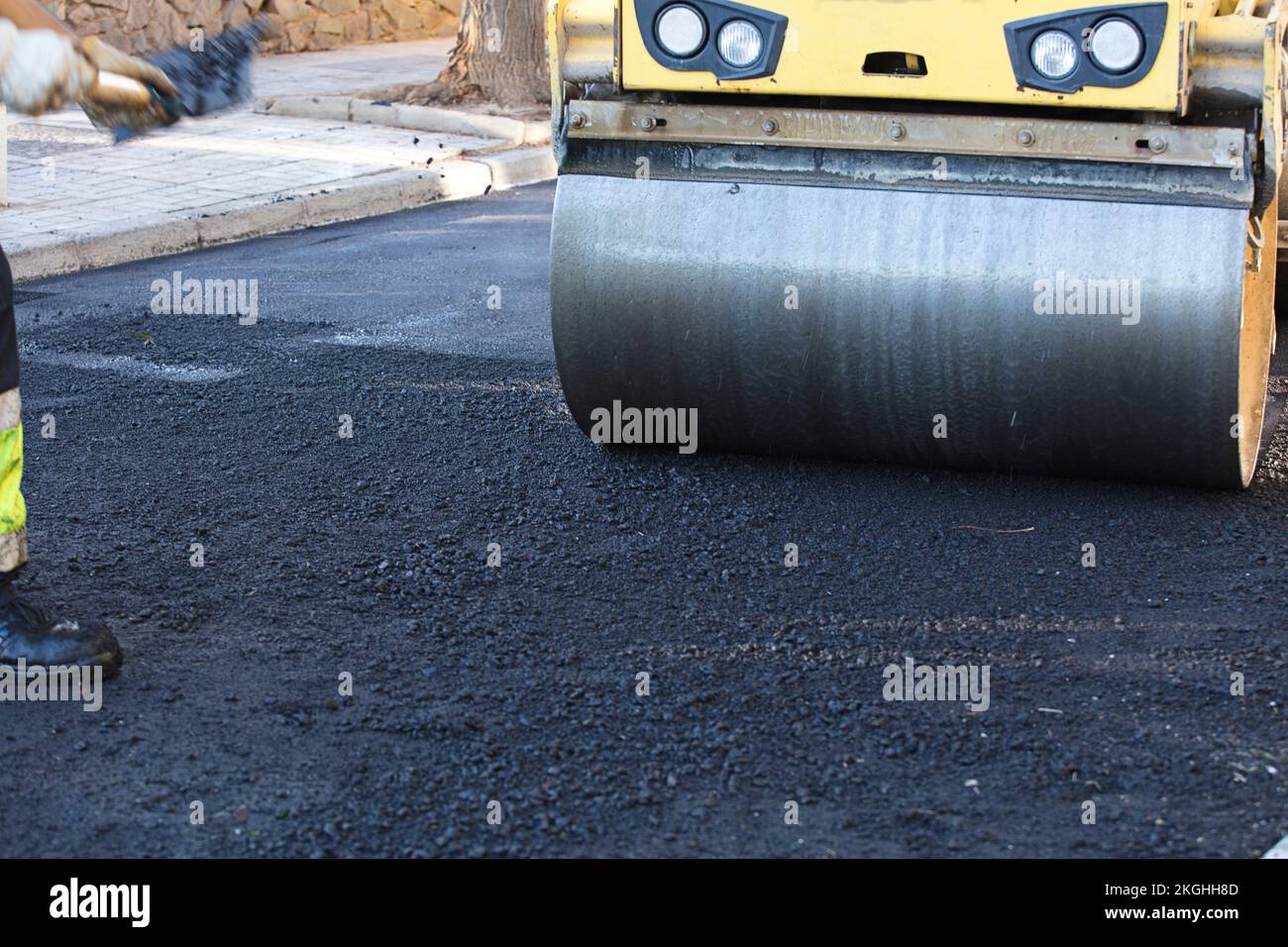Road roller and asphalt paving machine at construction site Stock Photo ...