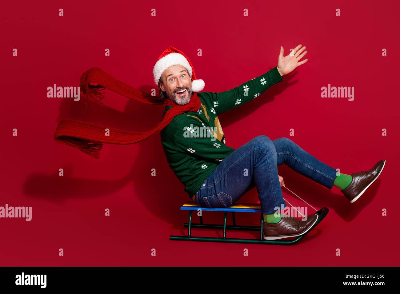 Full size profile portrait of overjoyed positive person sit ride sledge ...