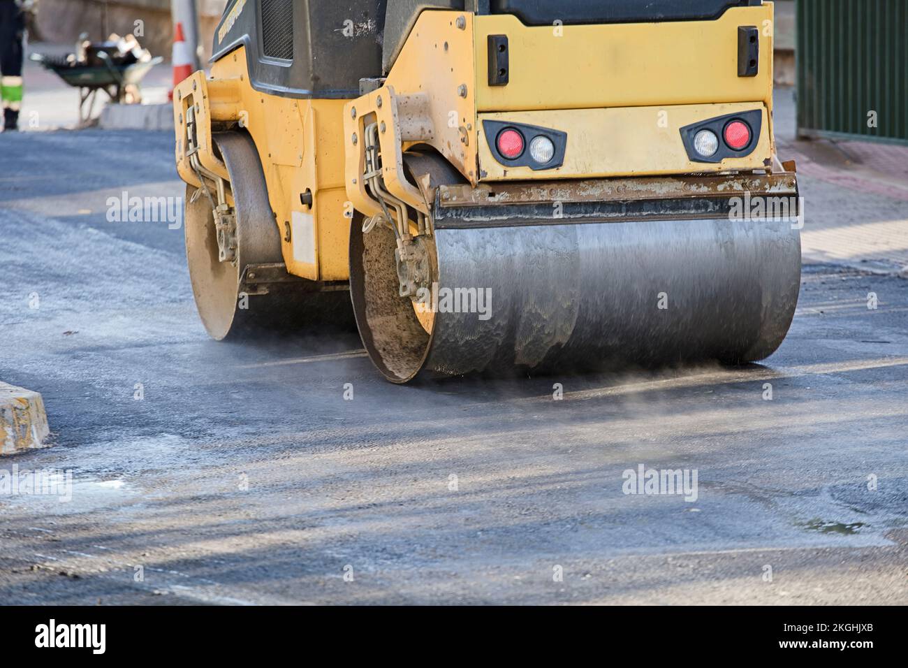 Road roller and asphalt paving machine at construction site Stock Photo ...