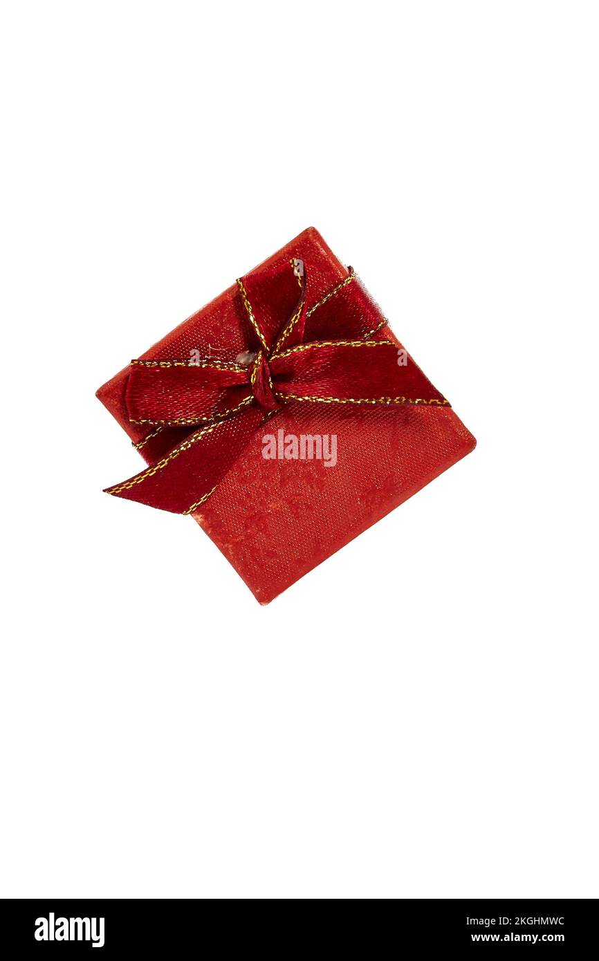 Red gift box with red ribbon bow with gold border on lid for ring or ...