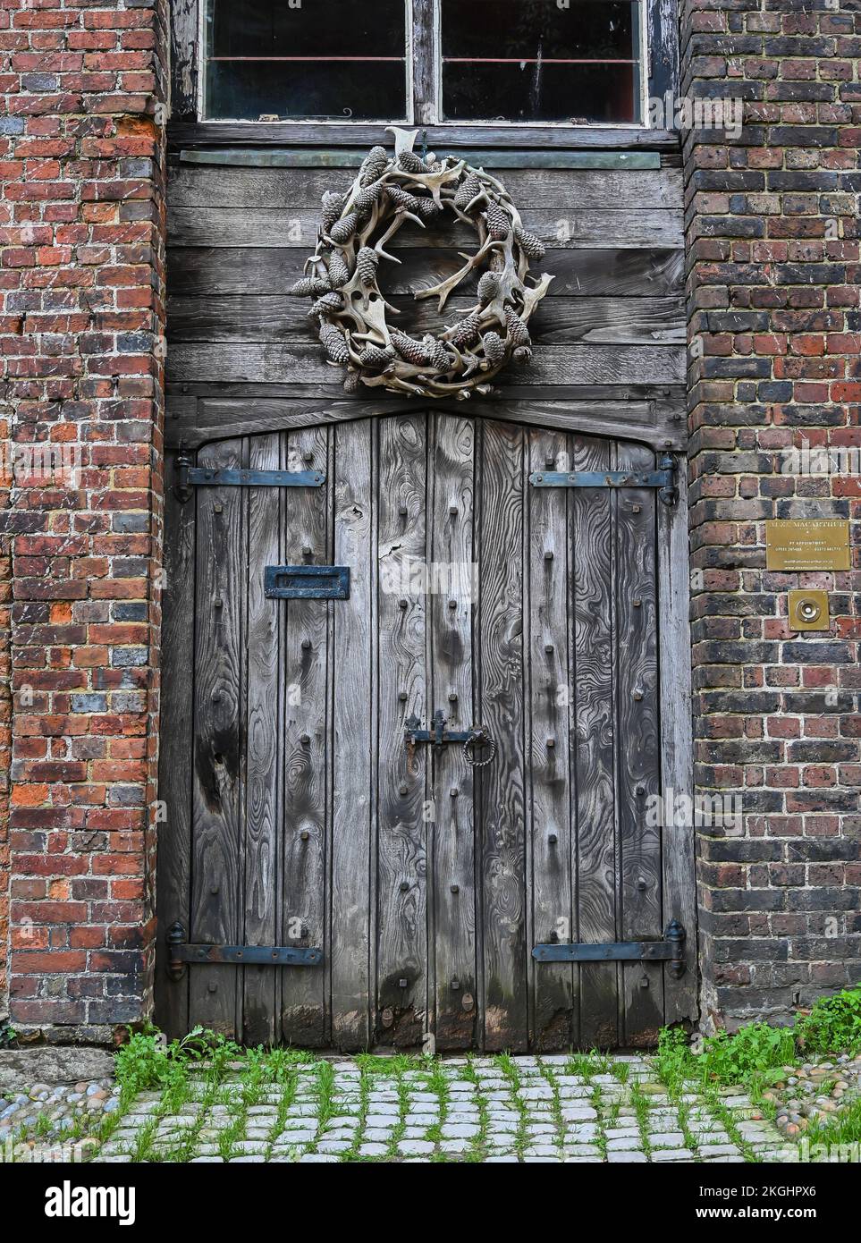 Rustic Wreath of Bone above old wooden doors in Rye Stock Photo - Alamy