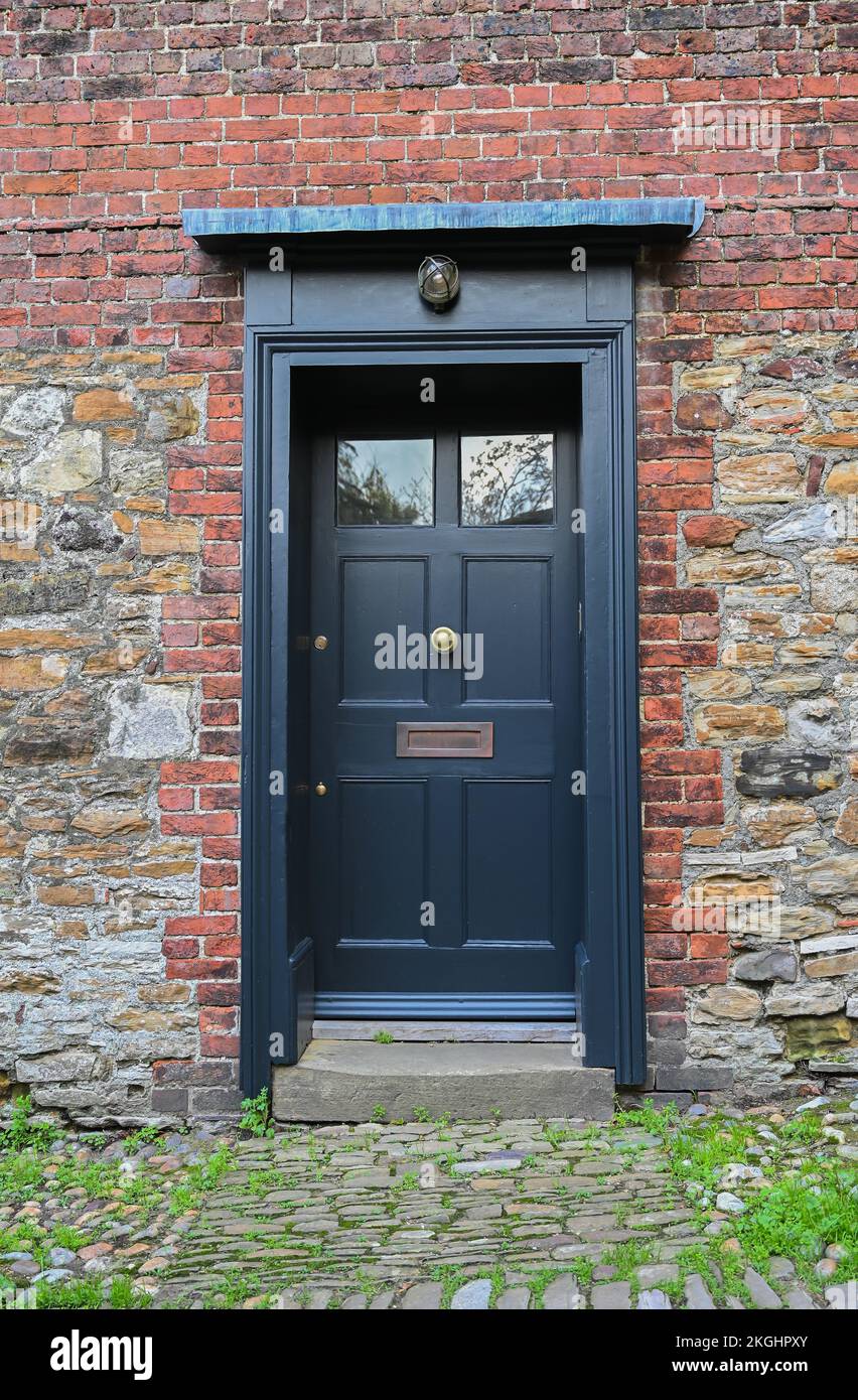 Black door in an alley in Rye Stock Photo - Alamy