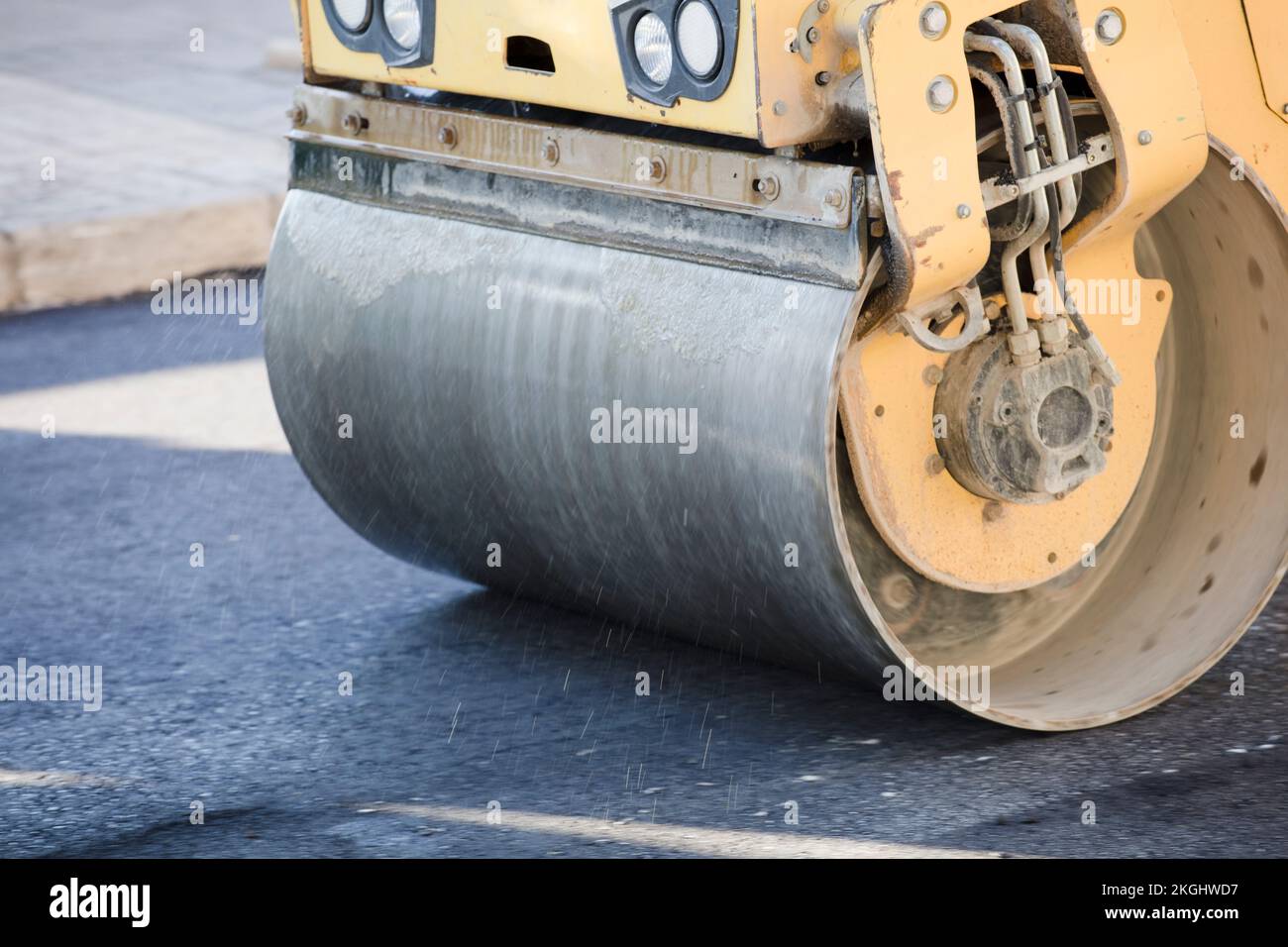 Road roller and asphalt paving machine at construction site Stock Photo ...