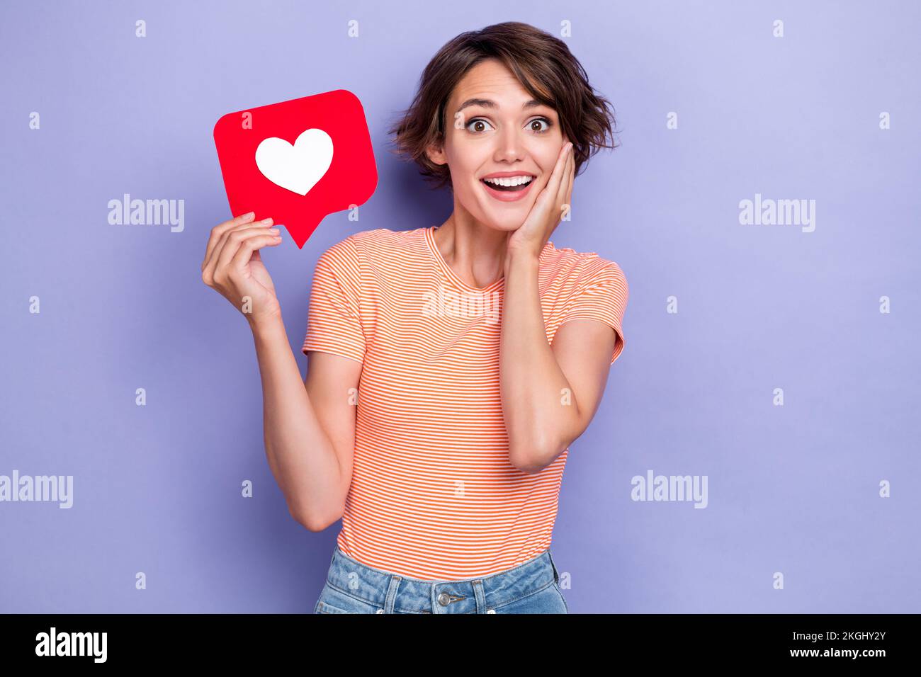 Photo of astonished impressed lady hand arm cheek face red paper card ...