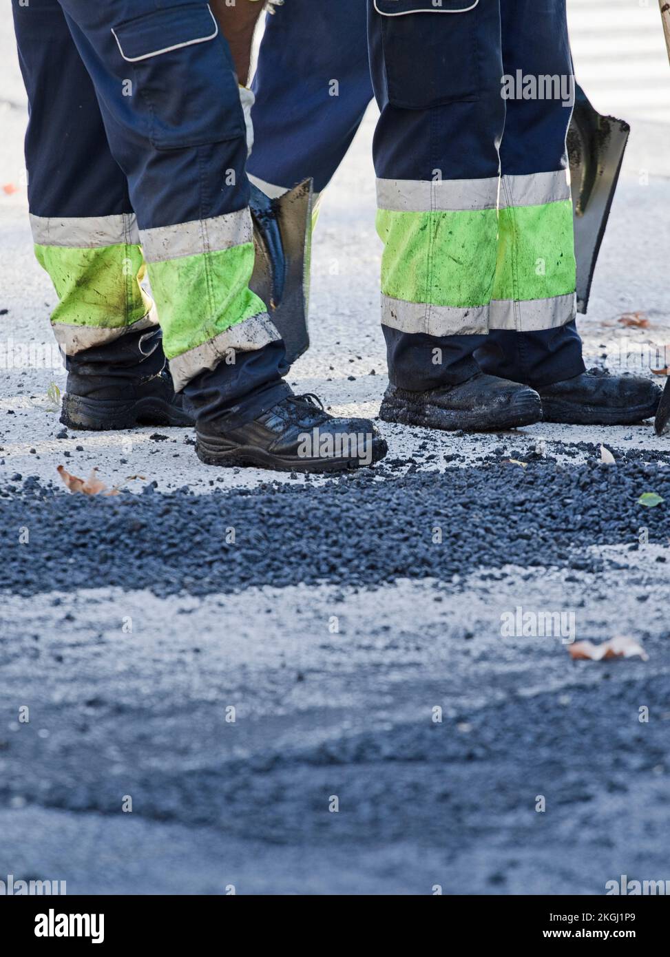 boots of workers in asphalt road construction Stock Photo - Alamy