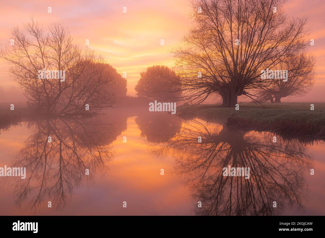 Warm tones sunrise on river Stour between Dedham and Flatford in ...