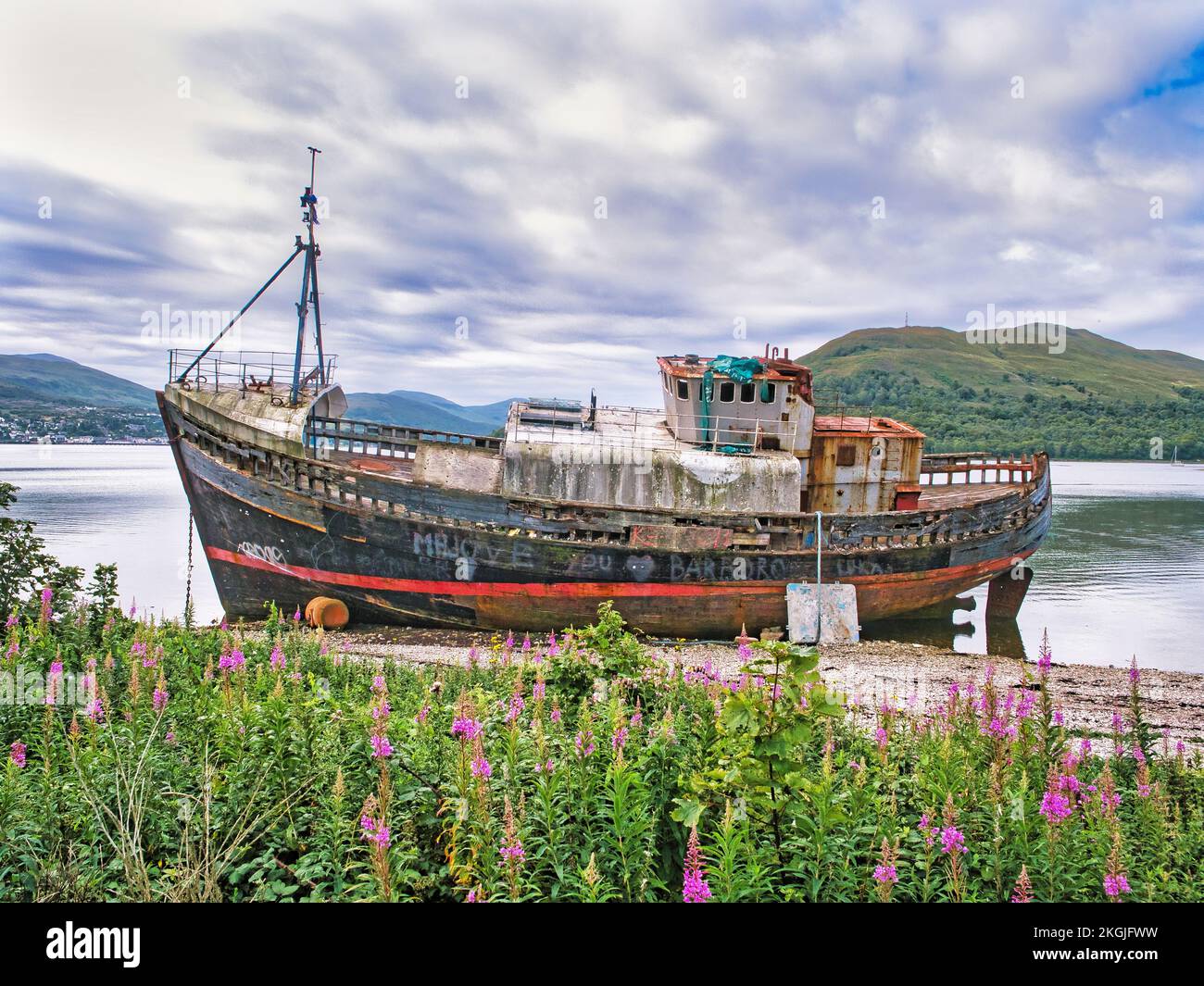 A fishing boat wrecked and aground in loch linnie fort william Stock ...