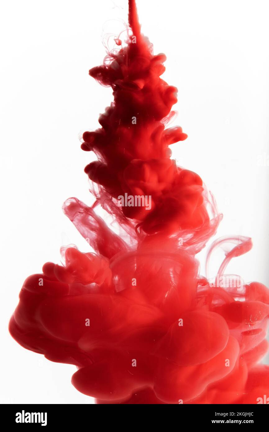 Red color flowing in smoke forms, smooth abstract moving by acrylic ...