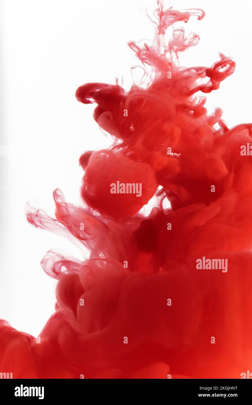 Red color flowing in smoke forms, smooth abstract moving by acrylic ...