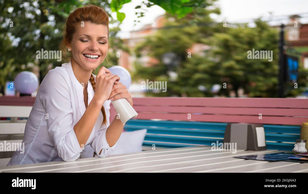 Smiley red haired woman hi-res stock photography and images - Alamy