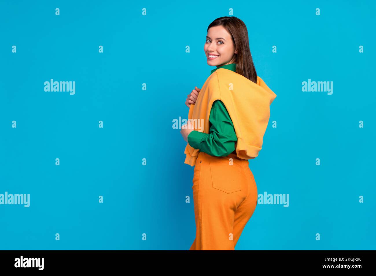 Rear portrait of cheerful lovely girl beaming smile empty space ...