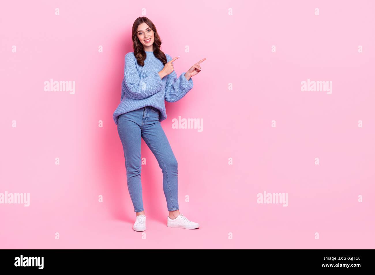 Full length portrait of cheerful pretty person indicate fingers empty ...