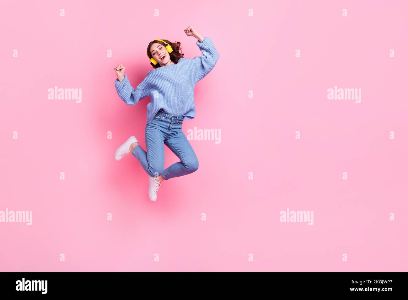 Full length portrait of delighted excited person jumping raise fists ...