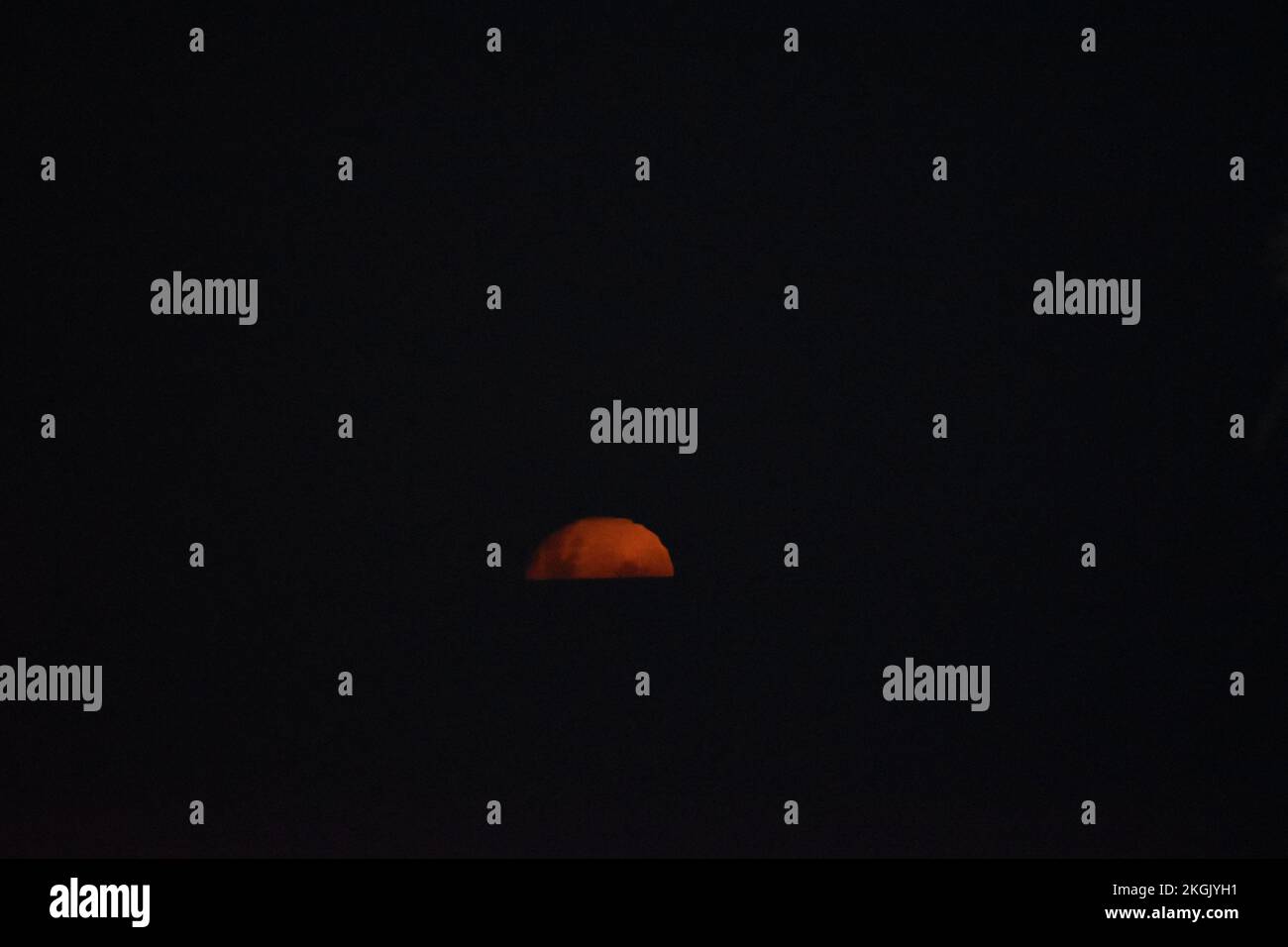 Red moon rising over water at Coogee beach Stock Photo - Alamy
