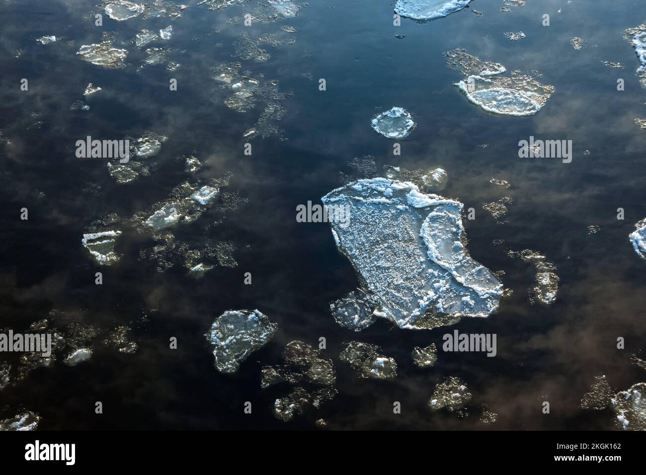 Melting ice flowing on water surface. Ice drift on the river. Global ...