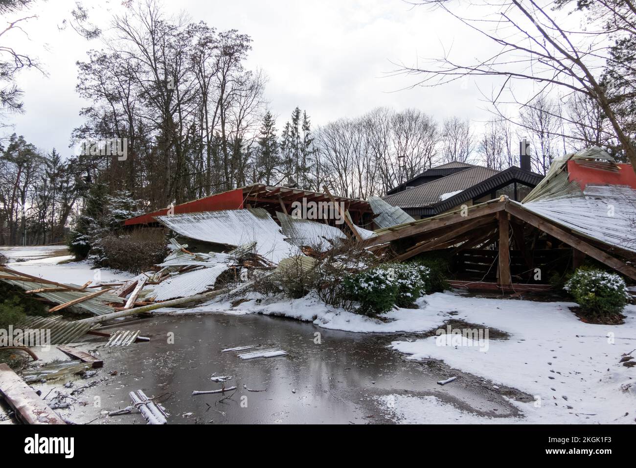 Collapsed roof of an old wooden building. Abandoned architecture, ruins ...