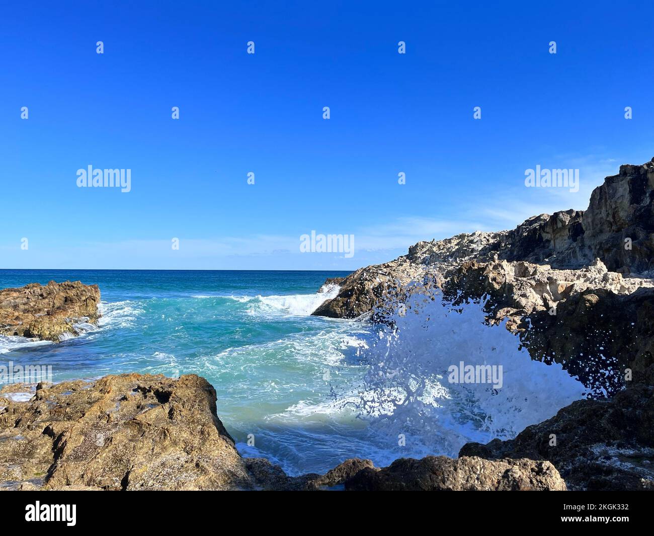 The beautiful view of the ocean waves crashing on the cliffs Stock ...