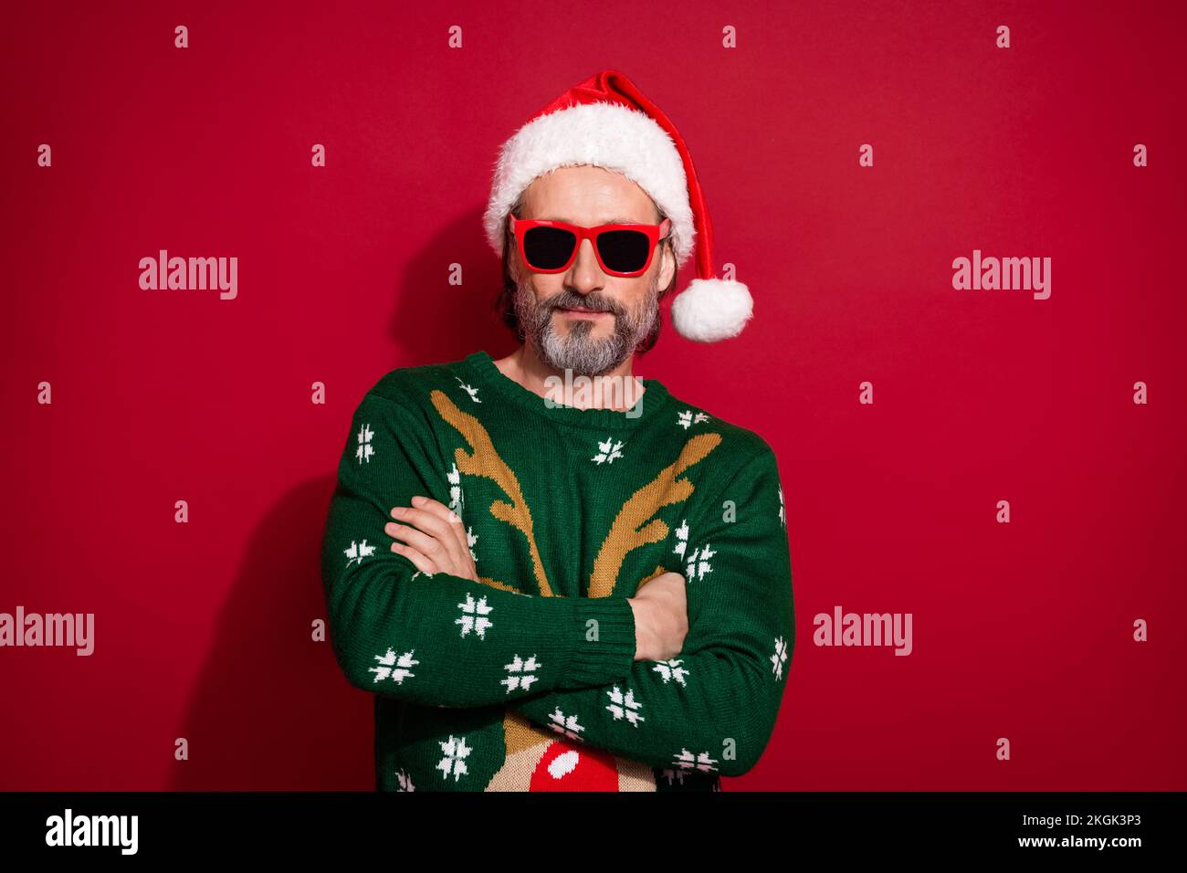Portrait of handsome confident person crossed hands santa headwear ...