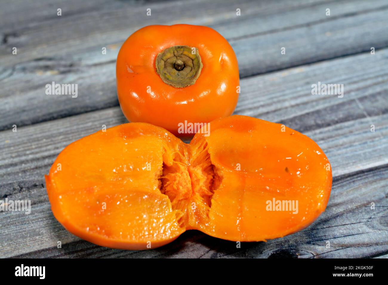 The persimmon is the edible fruit of a number of species of trees in ...