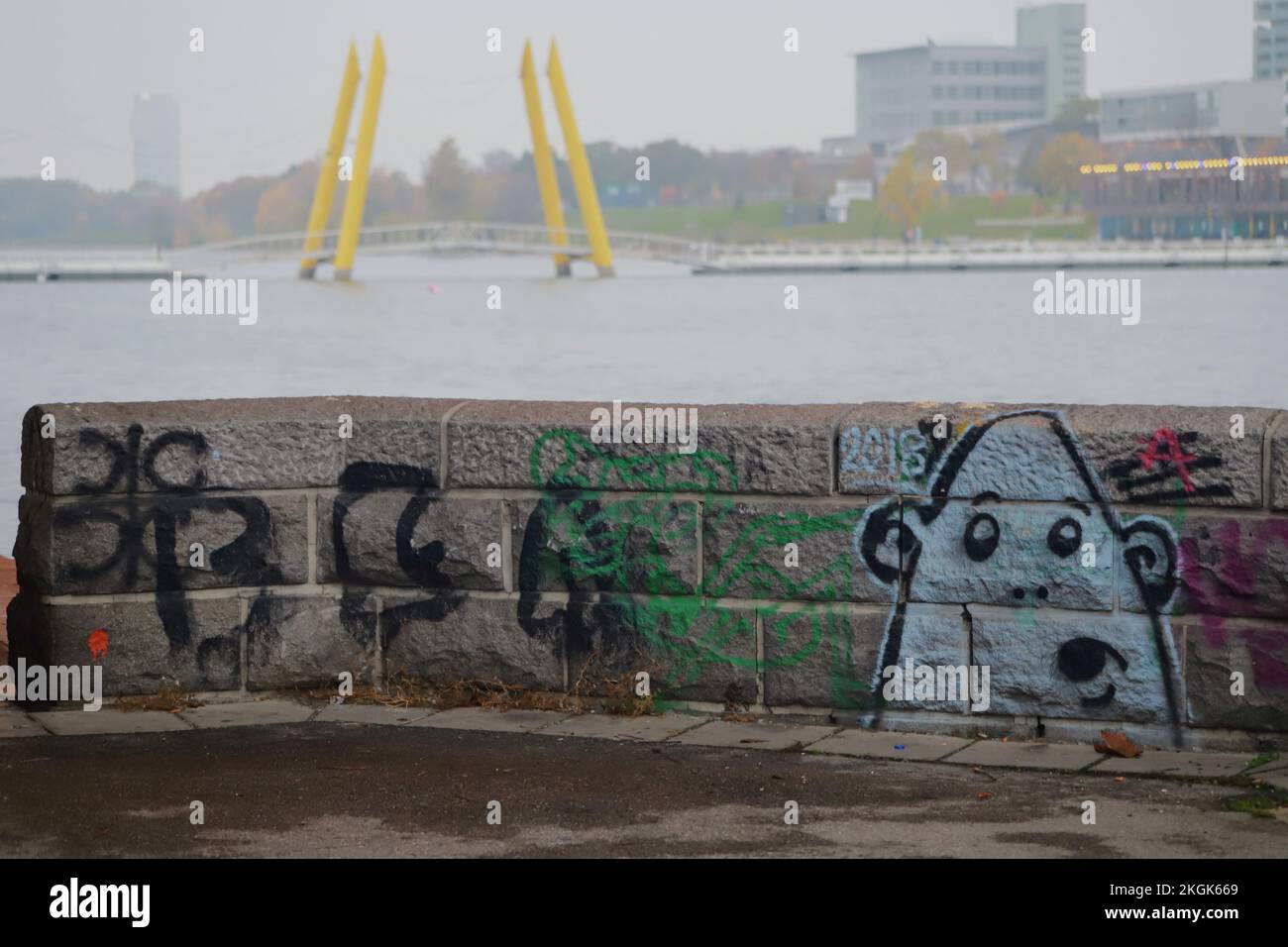 Modern street graffiti art in front of a pedestrian bridge in Vienna ...